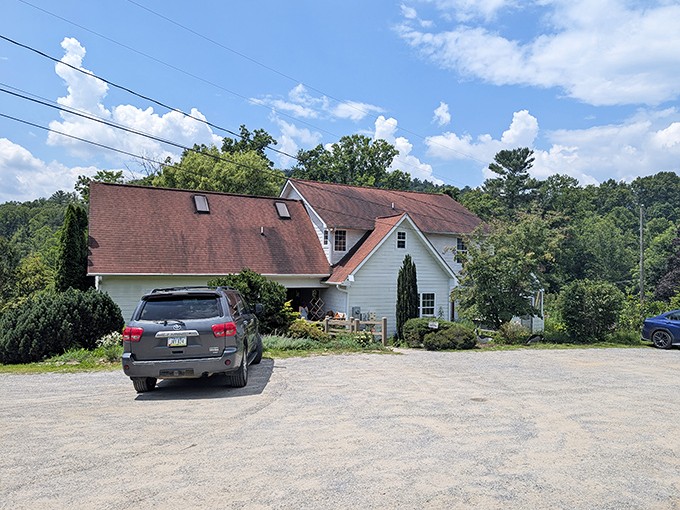 A charming white farmhouse beckons with its stone pathway and "OPEN" sign &ndash; like a storybook cottage that happens to make incredible sandwiches.