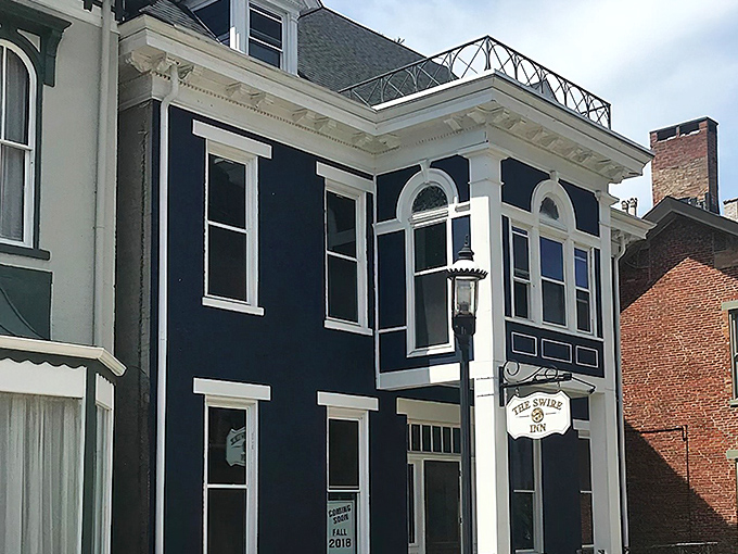 The navy blue fa&ccedil;ade with crisp white trim stands like a culinary lighthouse in downtown Middletown, beckoning hungry travelers with promises of comfort and charm.