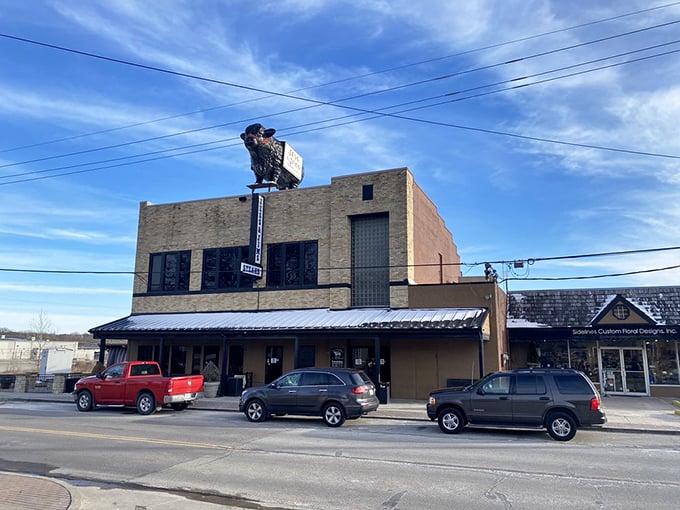 The iconic cow silhouette stands guard atop Jess & Jim's brick building, a beacon for carnivores that's been calling hungry Missourians home for generations.