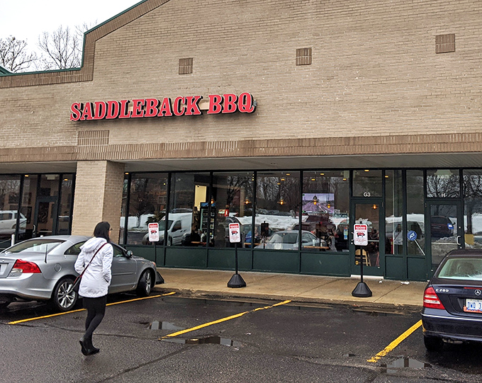 The unassuming brick exterior of Saddleback BBQ proves once again that the best barbecue joints don't need fancy facades—just follow your nose to the promised land.