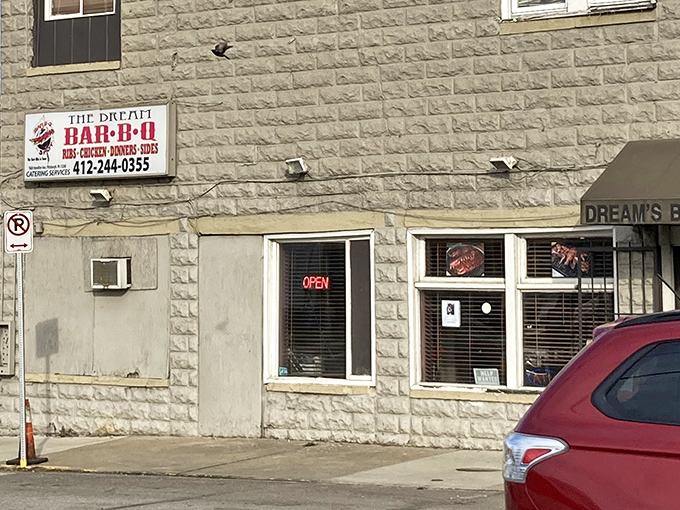 The unassuming stone exterior of The Dream BBQ in Homewood might not scream "food paradise," but your nose will know better once that smoky aroma hits.