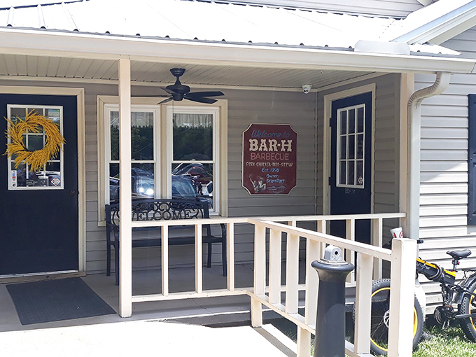 The unassuming exterior of Bar-H Barbecue stands like a beacon of hope for hungry travelers. No fancy frills, just the promise of smoky deliciousness inside.