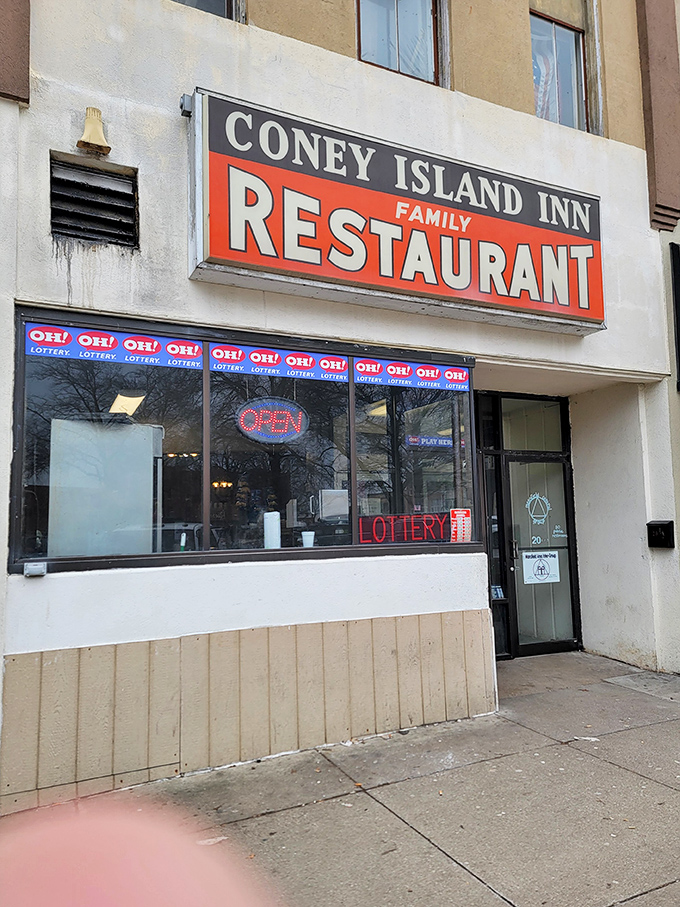 The classic red and blue sign beckons like a lighthouse for hungry travelers. Coney Island Inn has been a Mansfield landmark where comfort food dreams come true.
