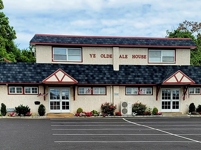 The unassuming exterior of Ye Olde Ale House stands like a culinary sentinel on Germantown Pike, promising comfort and satisfaction behind its Tudor-inspired facade.