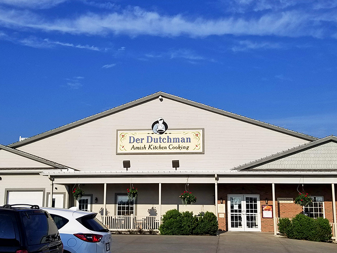 The welcoming facade of Der Dutchman stands like a beacon of comfort food promise under Ohio's big blue sky. Amish cooking awaits!