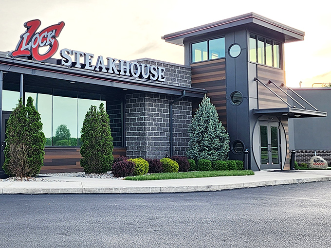 The modern facade of Lock Sixteen Steakhouse stands proudly in Elida, its distinctive red "16" logo beckoning hungry travelers like a culinary lighthouse.