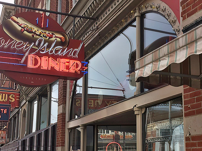 That iconic neon sign isn't just advertising – it's a time machine to when diners were the heartbeat of American downtowns.
