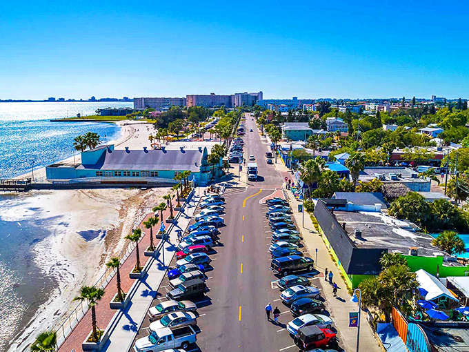 Boca Ciega Bay sparkles like nature's own disco ball, offering a waterfront playground where boats bob peacefully and palm trees stand sentinel along the shore.