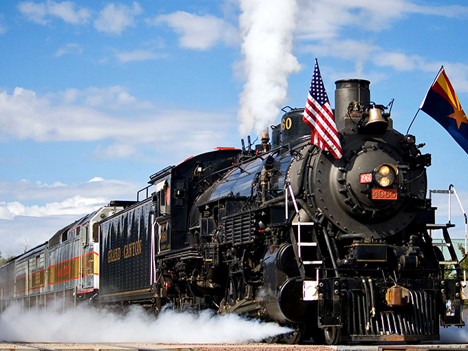 The mighty steam locomotive chugs through Arizona's high desert, a magnificent iron horse pulling passengers through time as much as through scenery.