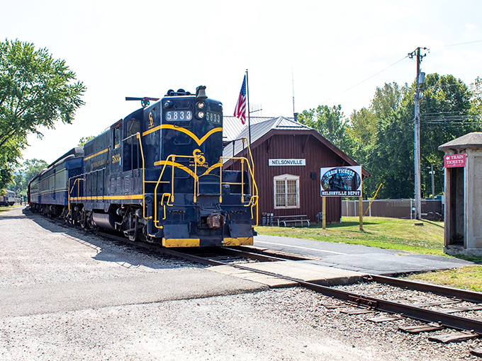 Engine #5833 stands proudly at Nelsonville Depot, like a navy-blue sentinel with golden trim guarding the gateway to Ohio's railway past.