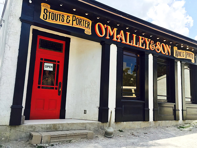 That red door isn't just an entrance&mdash;it's a portal to underground beer paradise. O'Malley's classic storefront gives only the slightest hint of what awaits below.