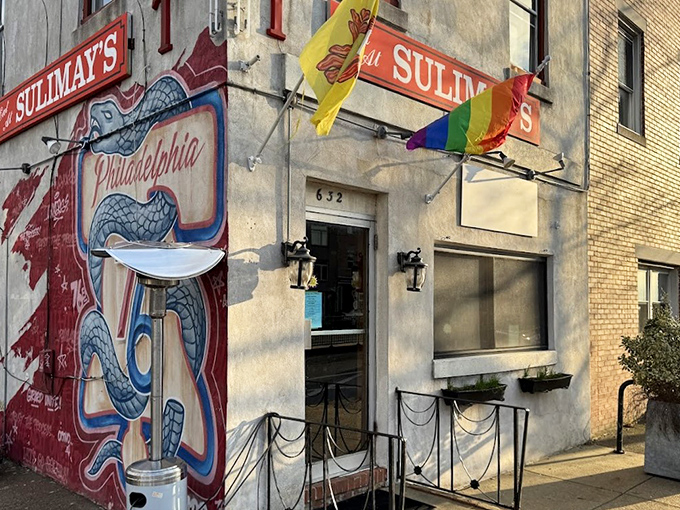 Sulimay's exterior welcomes you with old-school charm and a rainbow flag, promising both tradition and inclusivity in this Fishtown cornerstone.