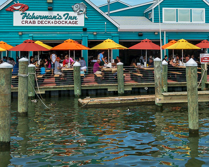The iconic blue crab sculpture welcomes you to seafood paradise, standing guard like the Chesapeake Bay's unofficial mascot.