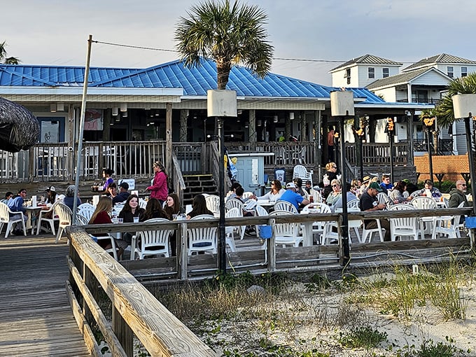The bright blue roof beckons like a tropical oasis on stilts. Beach access and seafood? That's not a vacation, that's heaven on earth.