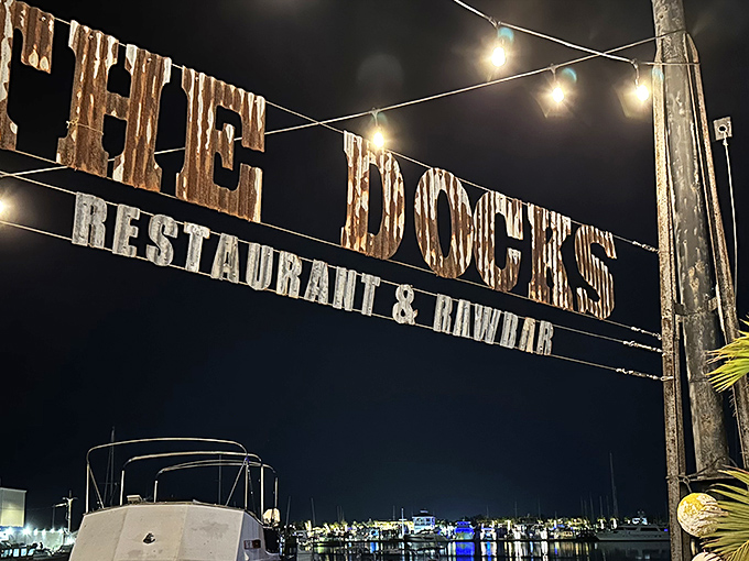 Where sea meets sky: The Docks' entrance frames the Key West harbor like a living postcard, promising seafood adventures just steps from where it's caught.
