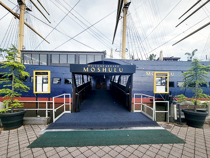 A maritime adventure awaits at Moshulu's gangplank, where towering masts and palm trees create an unexpected tropical-meets-nautical welcome on Philadelphia's waterfront.