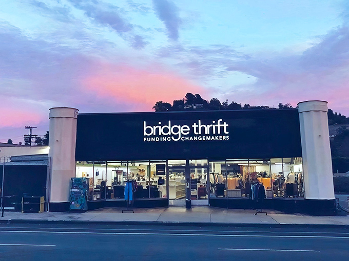 The sleek black exterior of Bridge Thrift stands out on Eagle Rock Boulevard like a beacon for bargain hunters seeking treasures with purpose.