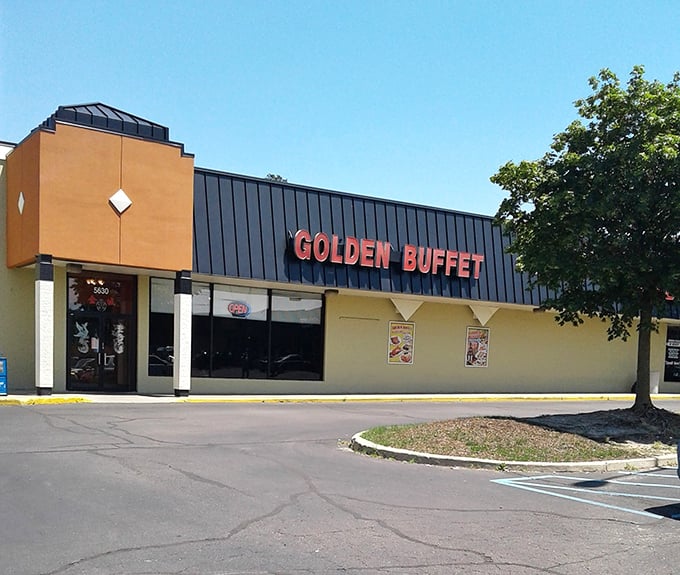 The bright red letters of Golden Buffet beckon from this unassuming strip mall like Vegas neon for the genuinely hungry. No pretense, just promises of abundance inside.