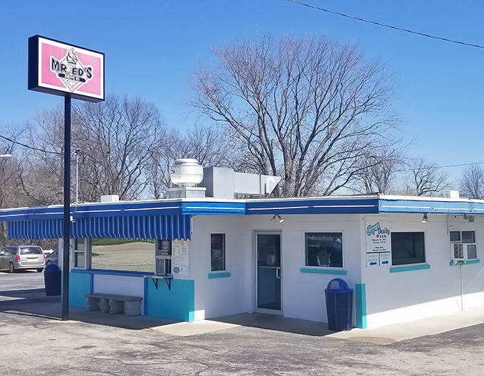 The blue-and-white time capsule that is Mr. Ed's Drive In stands proudly against the Missouri sky, beckoning hungry travelers with retro charm.