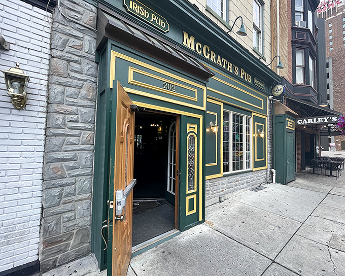 The emerald facade of McGrath's Pub beckons like an Irish lighthouse on Locust Street, its gold trim and wooden door promising authentic Celtic comfort in Pennsylvania's capital.
