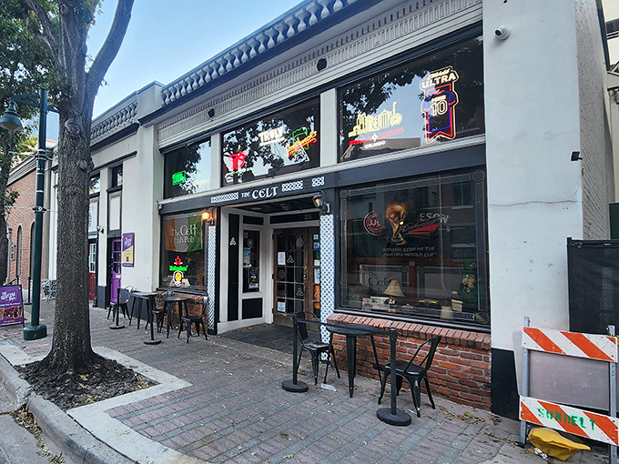 The unassuming storefront of Harp & Celt beckons like an old friend on Magnolia Avenue, promising authentic Irish comfort in downtown Orlando's urban landscape.