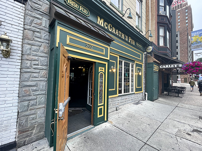 The emerald facade of McGrath's Pub stands proudly on Locust Street, its gold trim and vintage lanterns promising authentic Irish hospitality within these Pennsylvania walls.