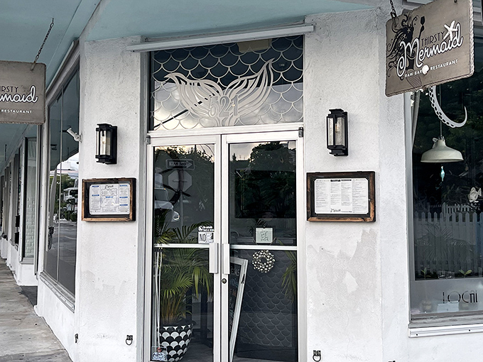 The mermaid-adorned entrance beckons like a siren's call, promising seafood treasures within this unassuming Fleming Street gem.