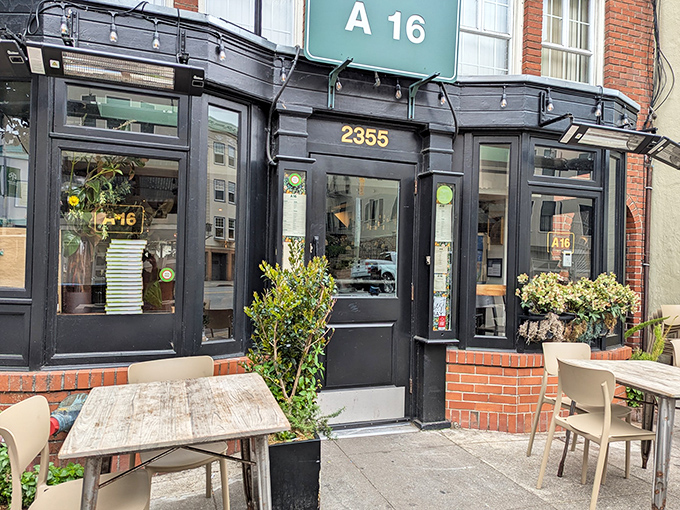 A16's sleek black exterior with mint-green signage stands like a culinary embassy from Southern Italy on San Francisco's Chestnut Street.