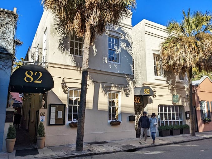 The elegant facade of 82 Queen stands proudly on its namesake street, palm trees swaying like Southern sentinels welcoming hungry visitors.
