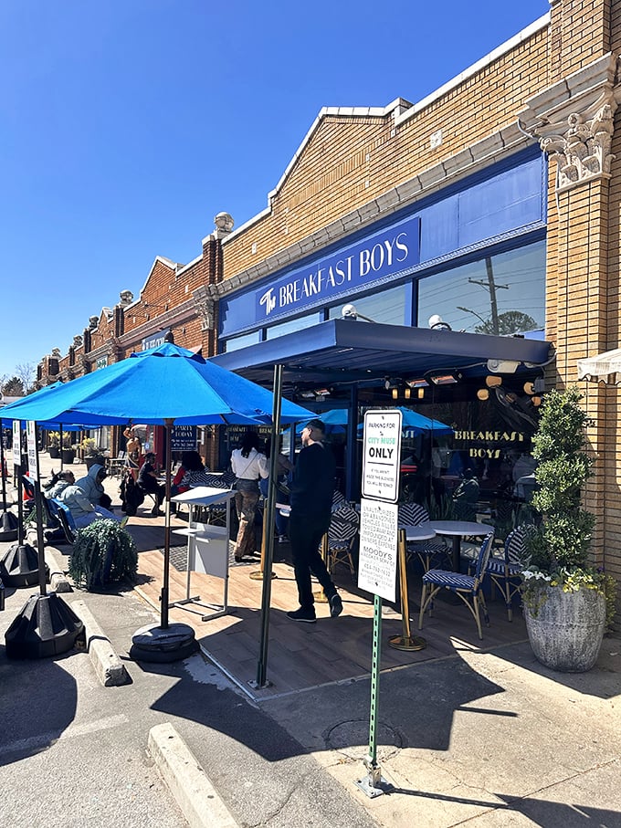 The blue awnings of The Breakfast Boys beckon like a morning oasis in College Park, where patio diners soak up Georgia sunshine while waiting for breakfast nirvana.
