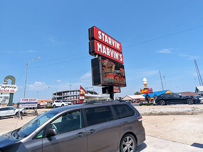 The rustic lodge-style exterior of Starvin Marvin's beckons hungry travelers like a siren song for seafood lovers in the Ozark hills.