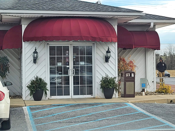 Those burgundy awnings aren't just decoration - they're a beacon calling hungry travelers to Pennsylvania comfort food paradise.