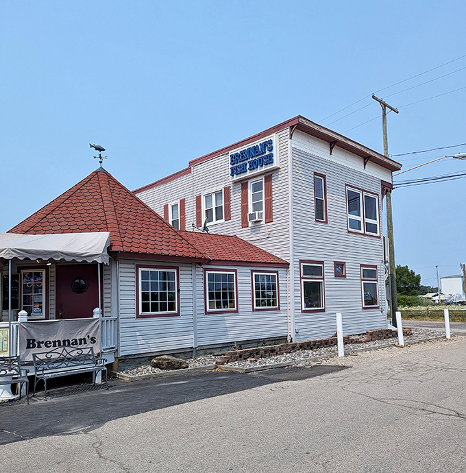 The unassuming exterior of Brennan's Fish House stands like a maritime sentry, its distinctive red-roofed entrance beckoning hungry travelers with the promise of Lake Erie's finest.