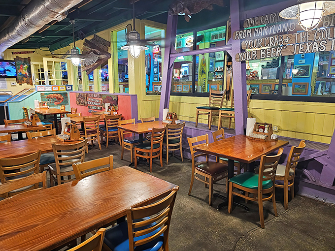 The bright blue exterior of Pinchers stands like a cheerful beacon on the Naples waterfront, promising seafood treasures within those colorful walls.