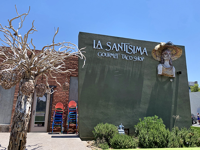 The lime-green exterior of La Santisima stands out like a beacon of taco promise, complete with a folk art figure wearing what might be Arizona's most stylish sombrero.