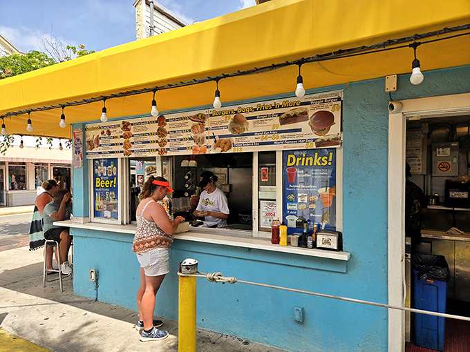 That turquoise paint job isn't just a color choice &ndash; it's a beacon calling hungry souls to seafood salvation.