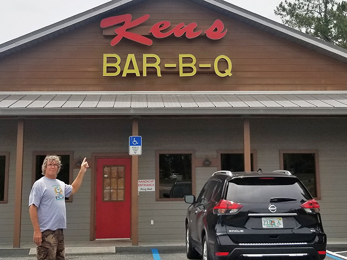 The red neon sign beckons like a lighthouse for hungry travelers. Ken's unassuming exterior promises what truly matters in barbecue: substance over style.