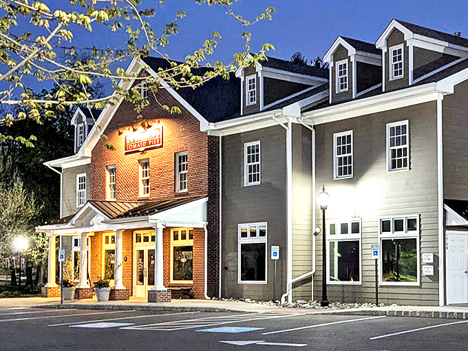 As twilight falls, DeLorenzo's brick facade glows like a beacon for hungry travelers. This isn't just dinner&mdash;it's a pilgrimage to pizza paradise.