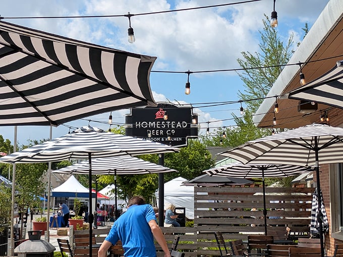The patio at Homestead beckons with its striped umbrellas and string lights&mdash;a perfect spot for summer evenings when Ohio decides to behave weather-wise. 