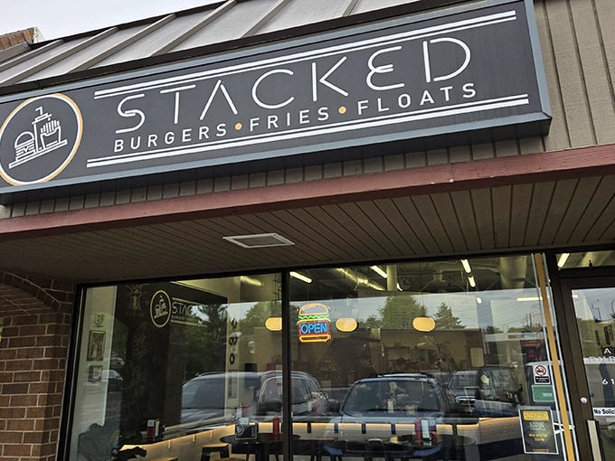 Stacked's bold blue signage promises a straightforward trinity of American comfort food classics: burgers, fries, and those glorious old-fashioned floats.