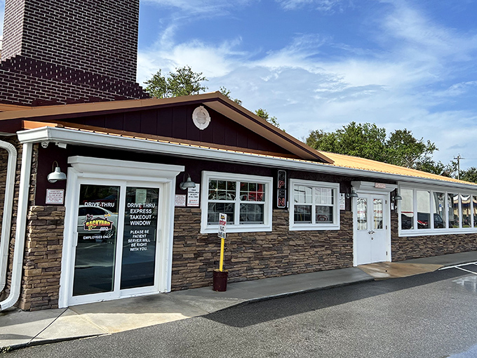 The unassuming exterior of Backyard Boys BBQ hides a smoky paradise within. Like finding a treasure map in your junk drawer&mdash;unremarkable until you realize what it leads to.