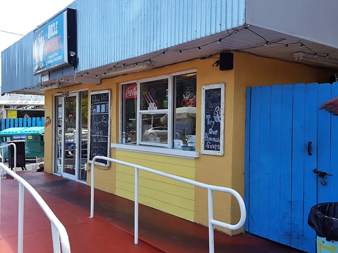 The lime green and electric blue exterior of Uncle Chicken's stands out like a tropical bird in a penguin convention. Florida roadside charm at its finest!