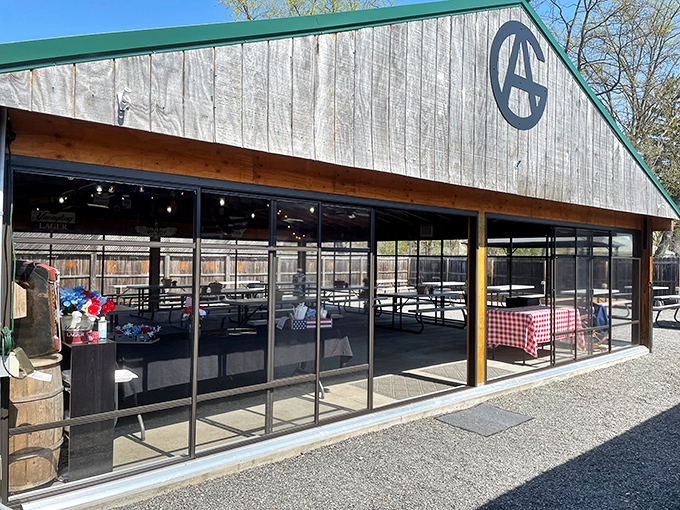 This weathered barn exterior hides Pennsylvania's best-kept barbecue secret, where smoke signals spell pure deliciousness.