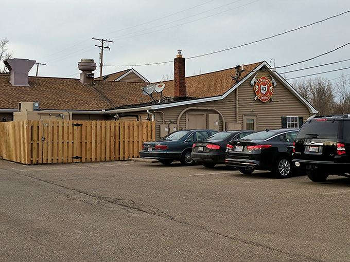 The unassuming exterior of Station 43 Tavern proves once again that culinary treasures often hide in plain sight, with its firehouse emblem promising heated delights within.