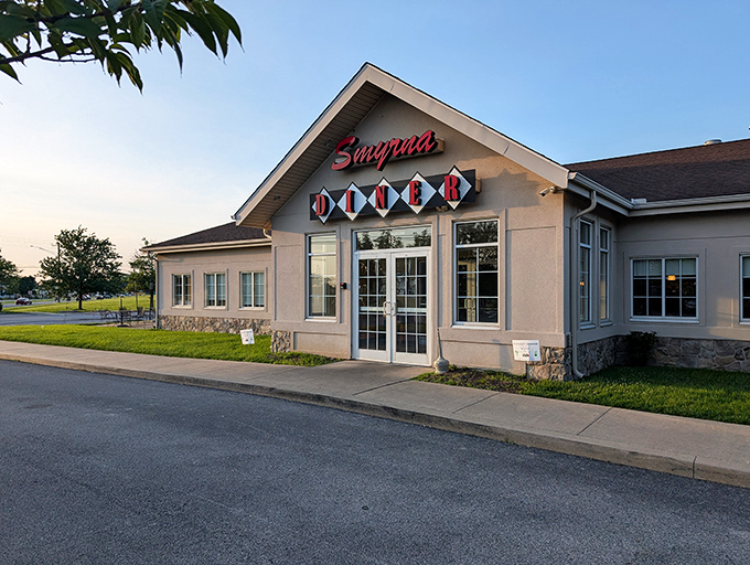 The iconic red Smyrna Diner sign beckons hungry travelers like a lighthouse for the famished. Delaware's answer to comfort food paradise awaits behind those doors.