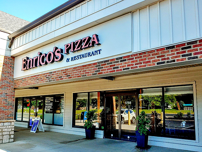 The unassuming storefront that houses pizza greatness. Like finding a Picasso at a yard sale, Enrico's modest exterior belies the culinary treasures within.
