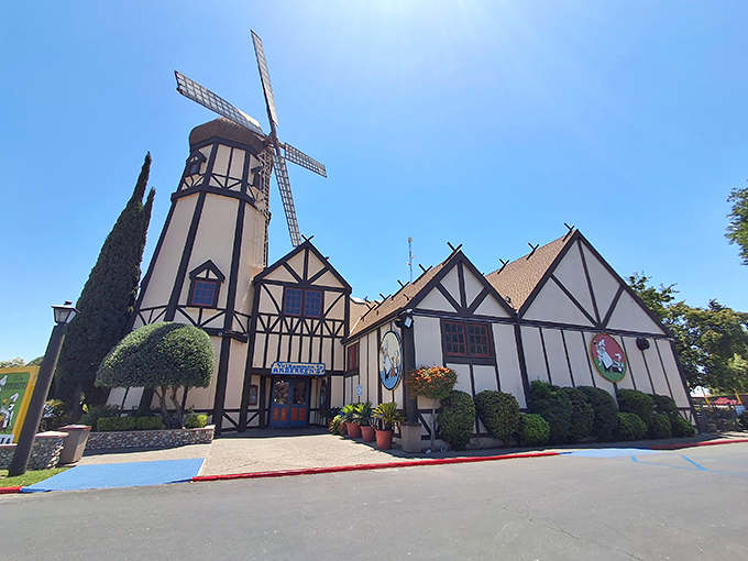 The iconic windmill of Pea Soup Andersen's stands like a Danish mirage in the California heat, beckoning road-weary travelers with promises of comfort food and quirky charm.