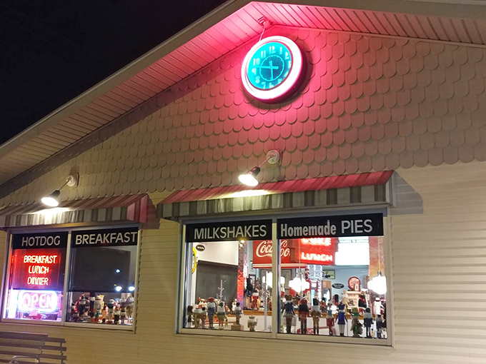 The neon glow of that iconic clock sign beckons like a lighthouse for hungry travelers. Homemade pies advertised right on the window&mdash;they know their strengths!