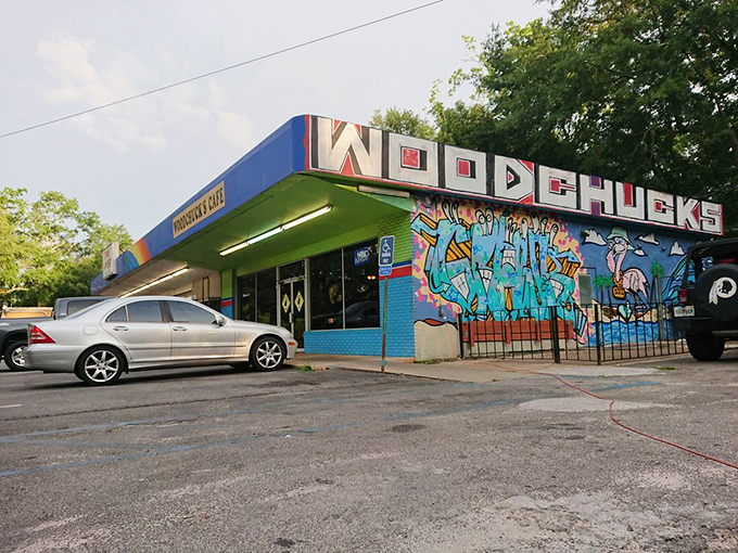 The vibrant blue exterior of Woodchuck's Cafe announces itself with colorful street art and a distinctive green awning&mdash;Tallahassee's breakfast rebellion in architectural form.