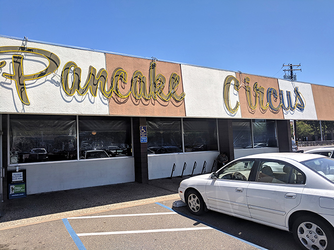 The iconic striped facade of Pancake Circus stands as a beacon of breakfast hope on Sacramento's Broadway. Classic Americana at its finest!